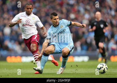 Leandro Bacuna of Aston Villa pressures Sergio Aguero of Manchester ...