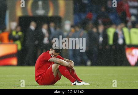 Dejan Lovren of Liverpool cries while sitting on the pitch during the ...
