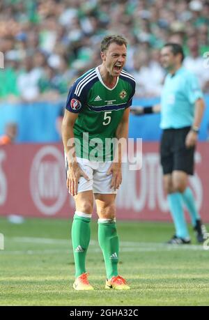 Northern Ireland's Jonny Evans looks dejected after Denmark's Jonas ...