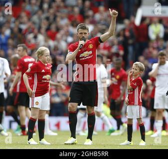 Michael Carrick with to his children Louise and Jacey after the game ...