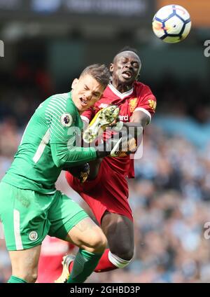 Ederson of Manchester City collides with Sadio Mane of Liverpool ...