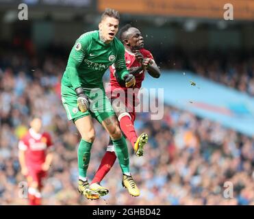 Ederson of Manchester City collides with Sadio Mane of Liverpool ...