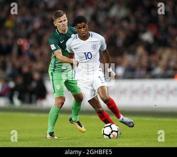 England's Marcus Rashford tussles with Slovenia's Aljaz Struna during ...