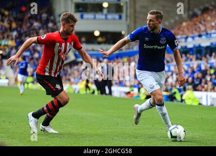 Everton's Gylfi Sigurdsson takes on Leicester City's Wesley Fofana and ...
