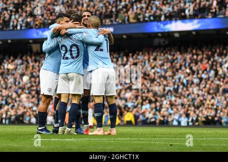 Manchester City players celebrate scoring during the Premier League ...