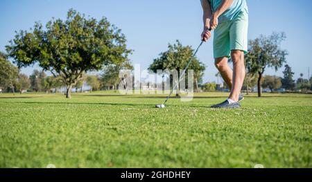 cropped man playing golf game on green grass, golf Stock Photo - Alamy