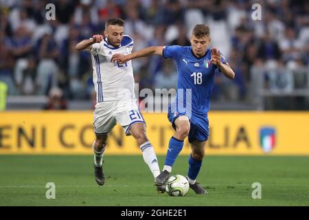 Elvis Saric of Bosnia and Nicolo Barella of Italy during the UEFA ...