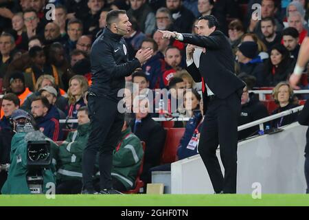 Fourth official Tim Robinson speaks to Pep Guardiola manager of ...