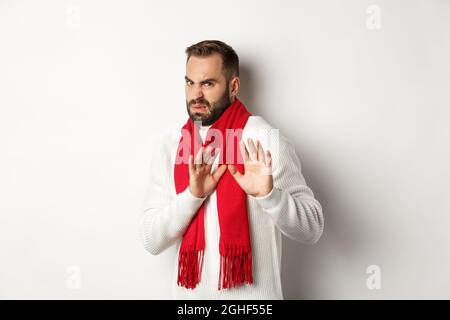 Displeased bearded man asking to stay away, showing decline and stop ...