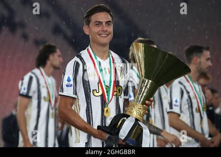 Paulo Dybala of Juventus celebrates with the Scudetto following the ...