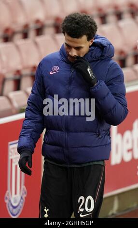 Dele Alli of Tottenham walks to the dressing room following his ...