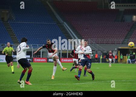 Zlatan Ibrahimovic of AC Milan fires a shot wide of the target during ...