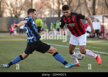 Kevin Bright of AC Milan challenges David Wieser of Internazionale ...