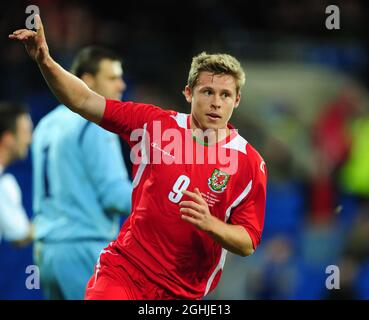 Simon Church of Wales celebrates his goal during the international ...