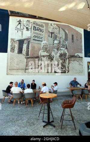 Young patrons enjoying a drink on the patio of Brandelli's Brig beneath ...