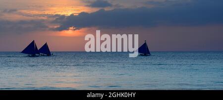 A romantic sunset enjoyed from the beach in Boracay island, Aklan ...