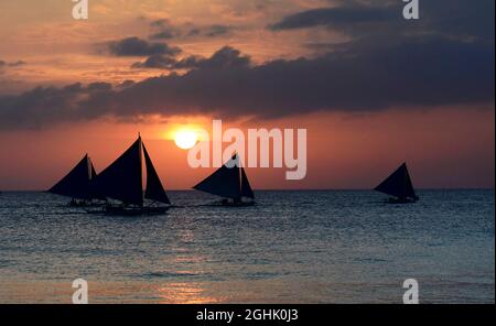 A romantic sunset enjoyed from the beach in Boracay island, Aklan ...
