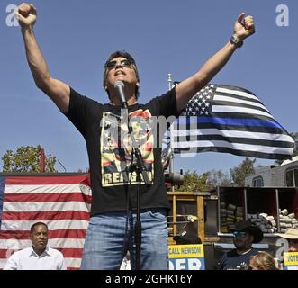 California Gov. Gavin Newsom, left, listens as Texas state ...