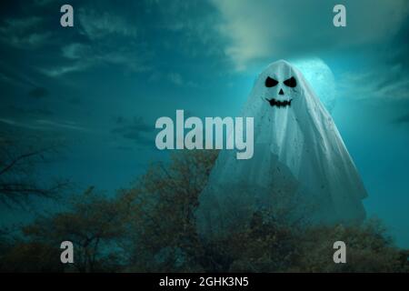 White ghost haunting with a night scene background. Halloween concept ...
