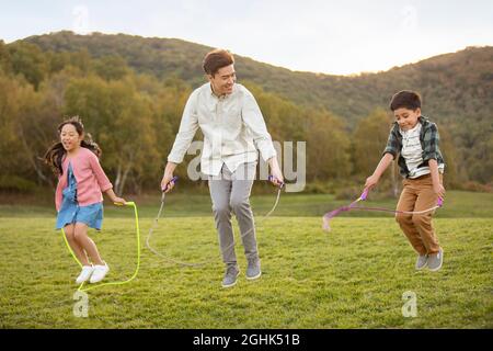Cute happy children with jumping ropes on white background, collage ...