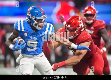 Louisville defensive lineman Ashton Gillotte runs a drill at the NFL ...