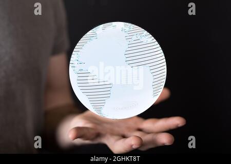 3D rendered futuristic globe hovering over a man's hand Stock Photo - Alamy