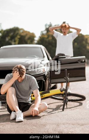 Young man falling off of bicycle dramatically Stock Photo - Alamy