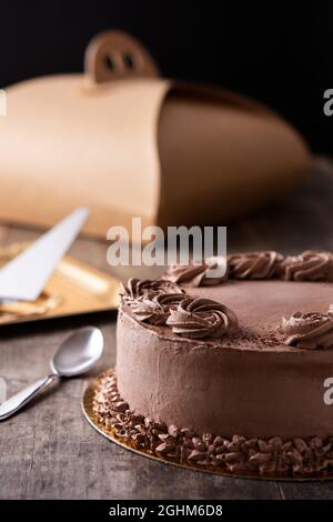 Chocolate truffle cake on wooden table Stock Photo - Alamy