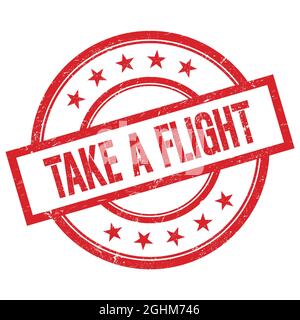 TAKE A FLIGHT text written on red grungy zig zag borders round stamp ...