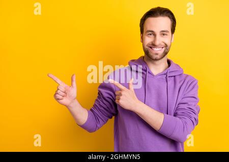 Photo of cheerful handsome male promote recommend object advertise sale ...