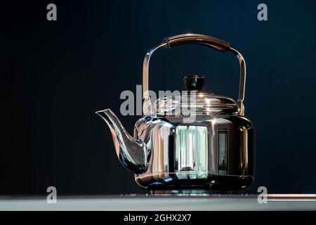 Stainless Water Crow or Vintage Kettle tea pot on electronic stove in ...