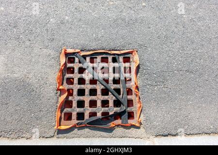 Below Grate Stormdrain Filter, a drop inlet filter secured by straps ...