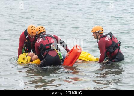 Rescue services; police, firefighter, lifeguards... carrying out rescue ...