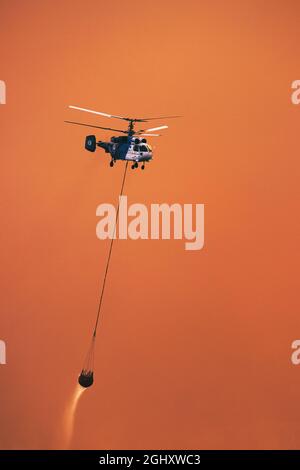 A shot of fire fighting by helicopter in Tasmania, Australia Stock ...