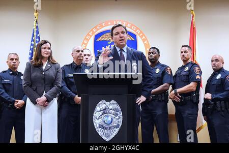 Florida Attorney General Ashley Moody, right, is sworn in by her father ...