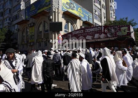 UMAN, UKRAINE - SEPTEMBER 7, 2021 - Men are seen in the street as ...