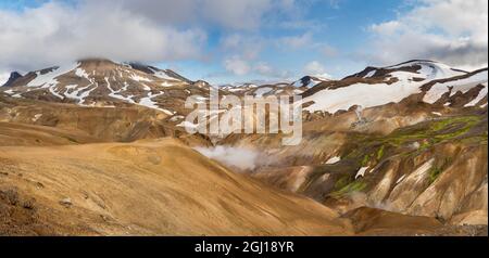 Hikers in the geothermal area of Hveradalir in the mountains of ...