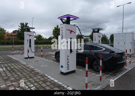 Forli Italy August 27 2021 A static shot of a solid black Tesla Model 3 dual motor long range awd charging at the Ionity DC fast charging station Stock Photo Alamy