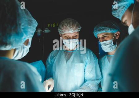Surgeon begins to work in the operating room with a skin incision at ...