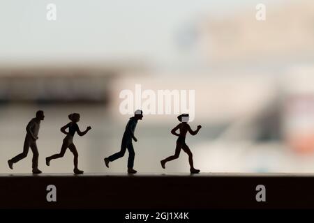 Runner miniature figure people running with lancet and Glucose meter on ...