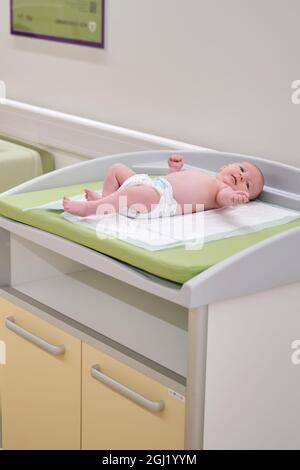 Child diaper table in a public restroom. Baby changing board by the ...