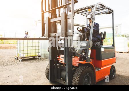 Yellow high rack stacker forklift in warehouse Stock Photo - Alamy