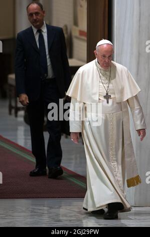 Pope Francis arrives in the Paul VI Hall at the Vatican for his weekly ...