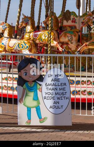 Sign for amusement ride height requirement Stock Photo - Alamy