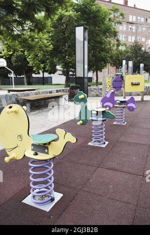 Row of spring rockers in different shapes in a playground Stock Photo ...