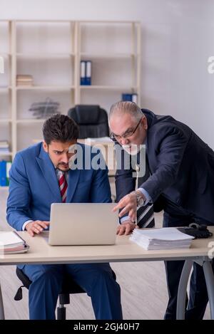 Angry boss scolding unqualified employee telling about mistake in ...