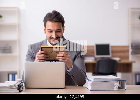 Young businessman employee missing girlfriend at workplace Stock Photo ...