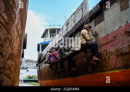 Shipyard workers near the Buriganga River in Dhaka.There are more than ...