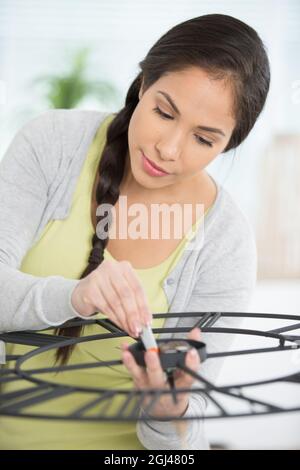 Woman changing clock for daylight saving time at home, closeup Stock ...