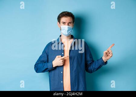 Covid and healthcare concept. Handsome modern guy in medical mask ...